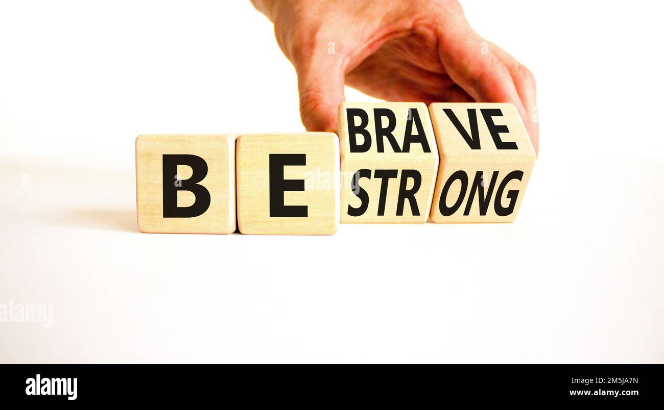 Be strong and brave symbol. Concept word Be strong Be brave on wooden ...