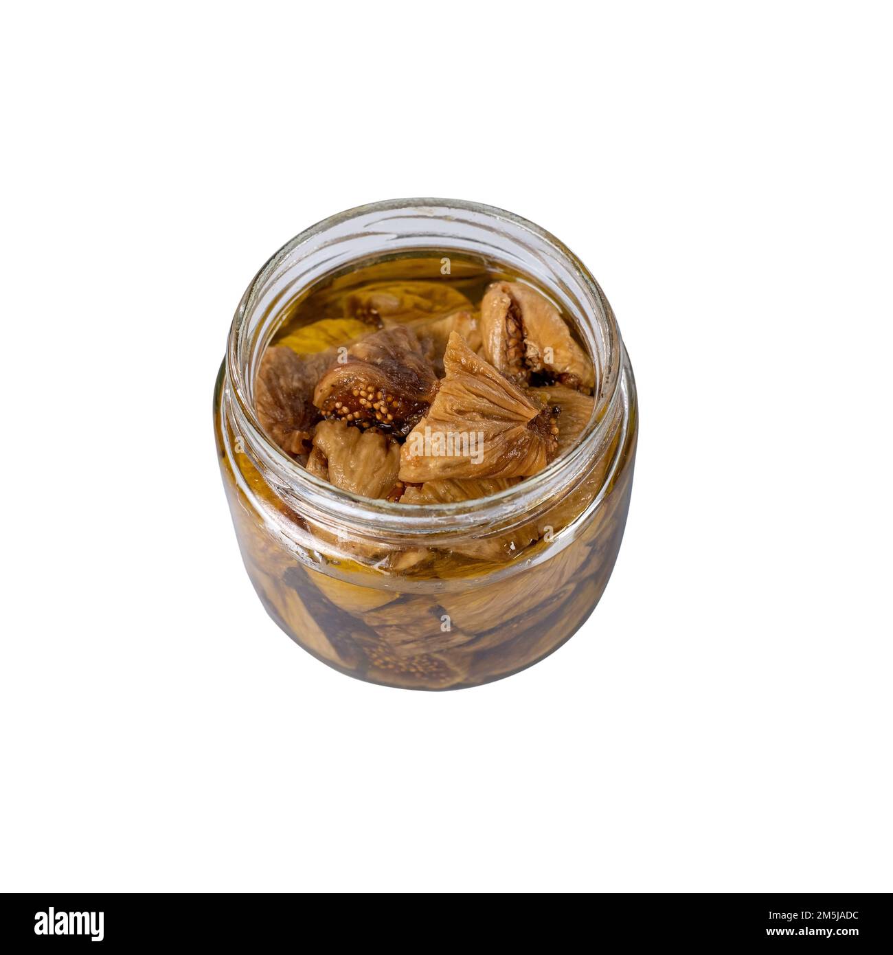 Close up glass jars with dried figs. Homemade fig jam with white ...