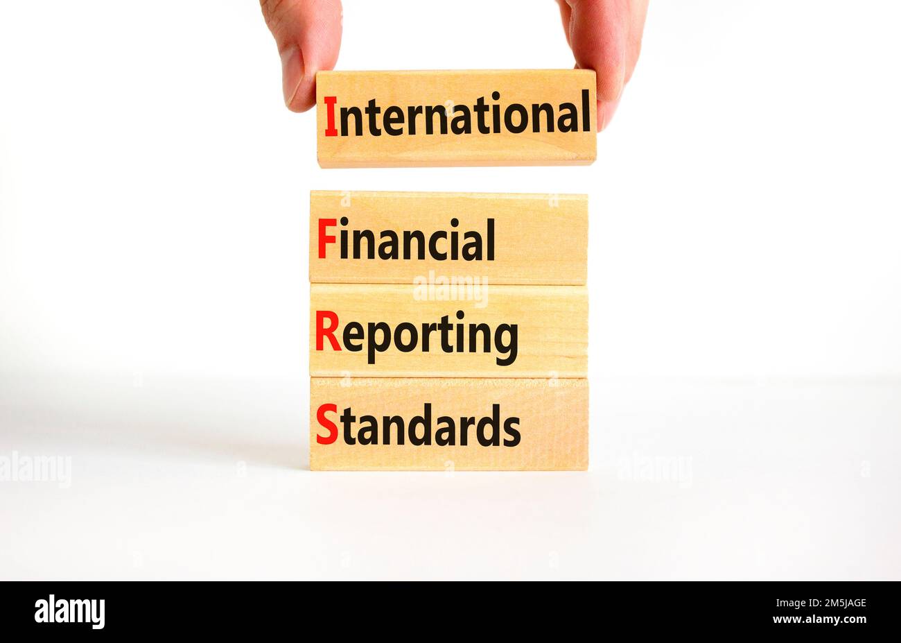 IFRS symbol. Concept words IFRS international financial reporting standards on block on ...