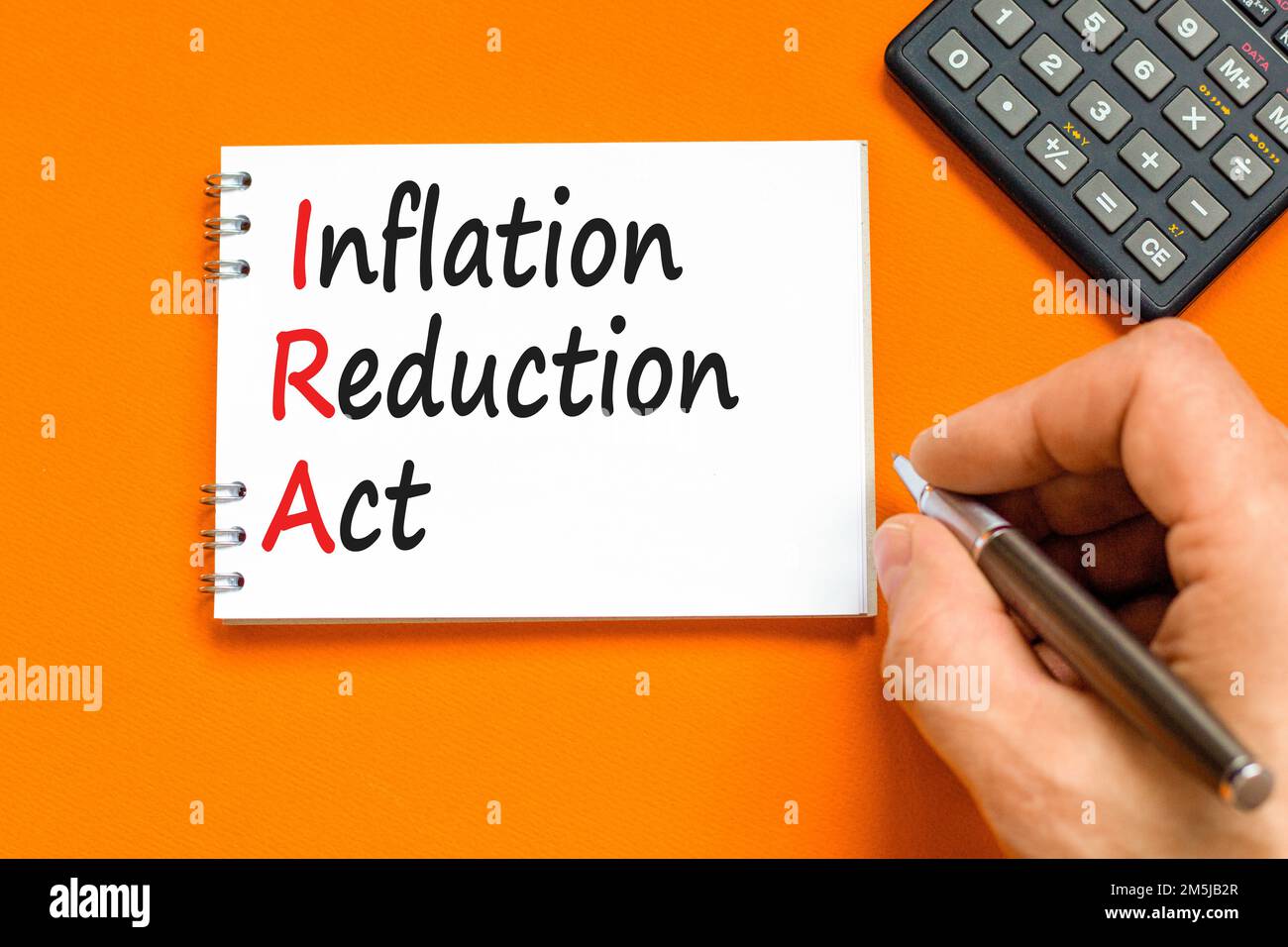 IRA inflation reduction act symbol. Concept words IRA inflation reduction act on white note on a ...