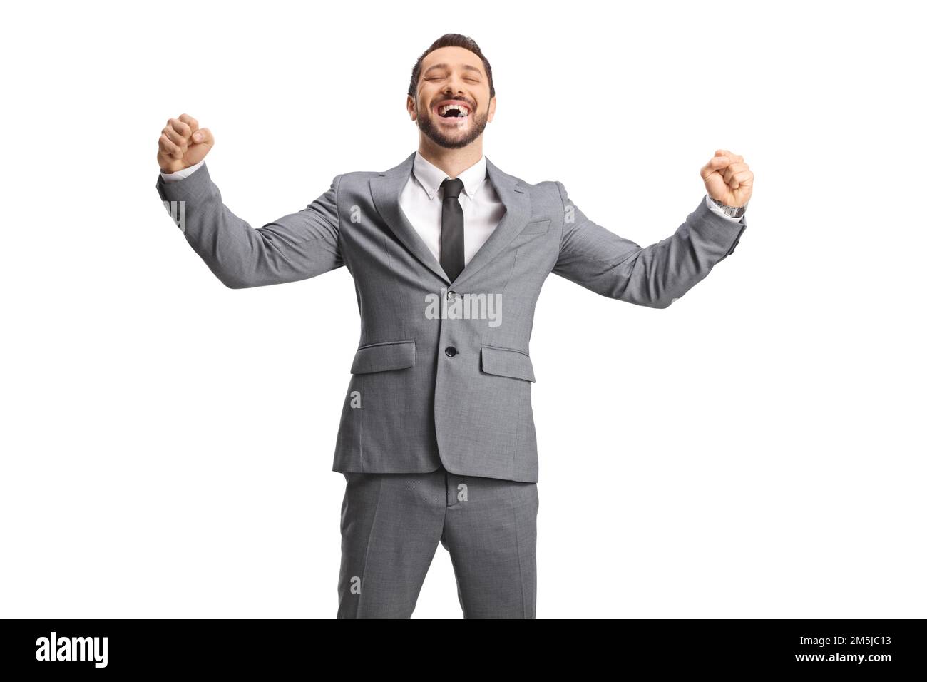 Happy professional man in a suit celebrating success isolated on white ...