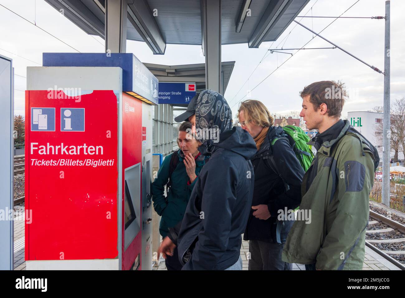 Dresden: passengers at ticket machine of Deutsche Bahn (DB) buying ...