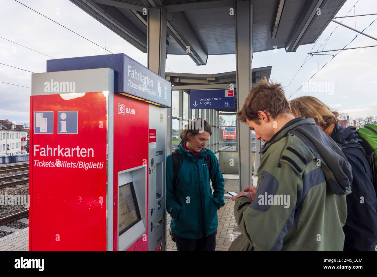 Dresden: passengers at ticket machine of Deutsche Bahn (DB) buying ...