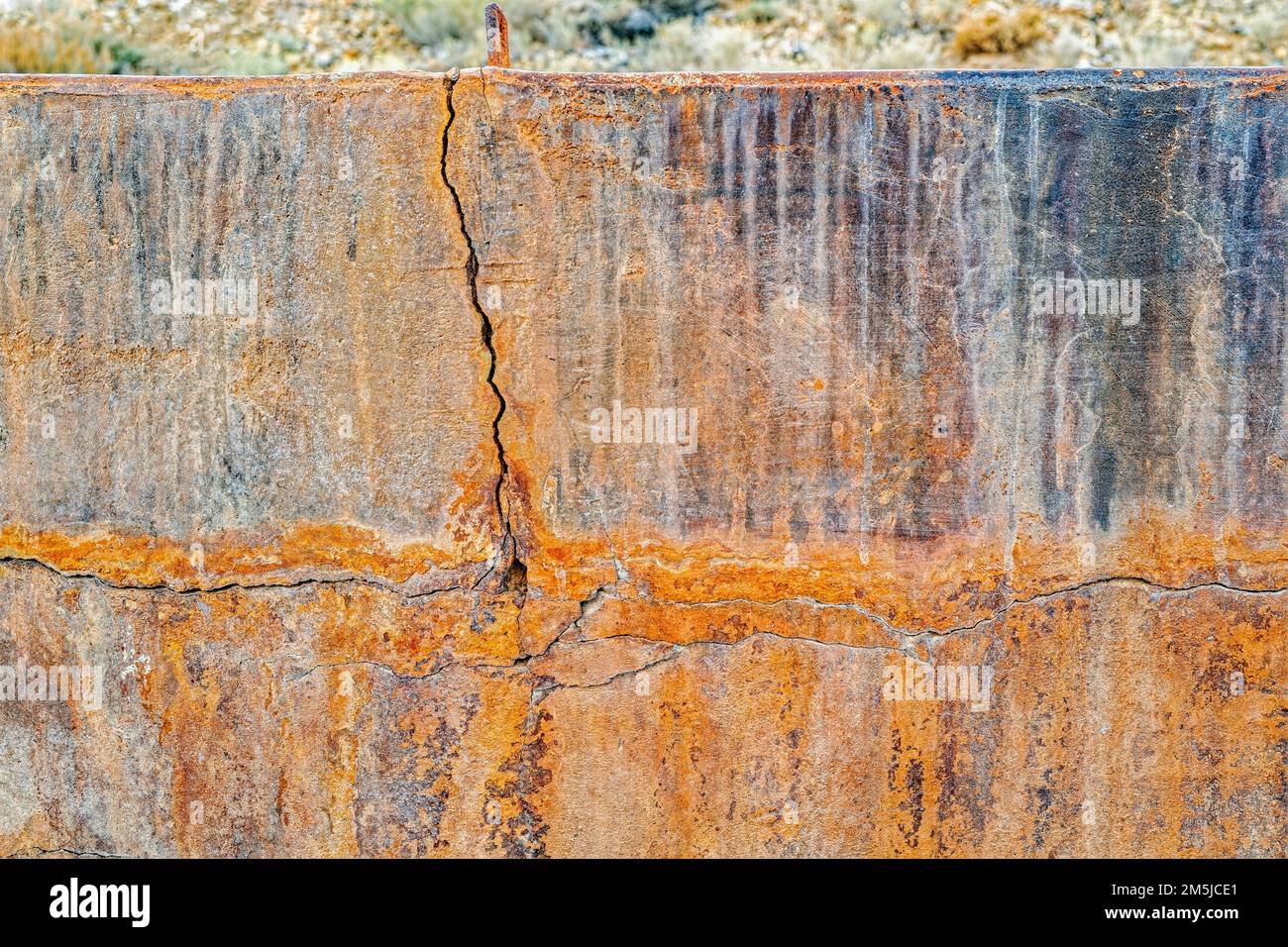 The cracks in the outer wall of a concrete bin at an abandoned mine in ...
