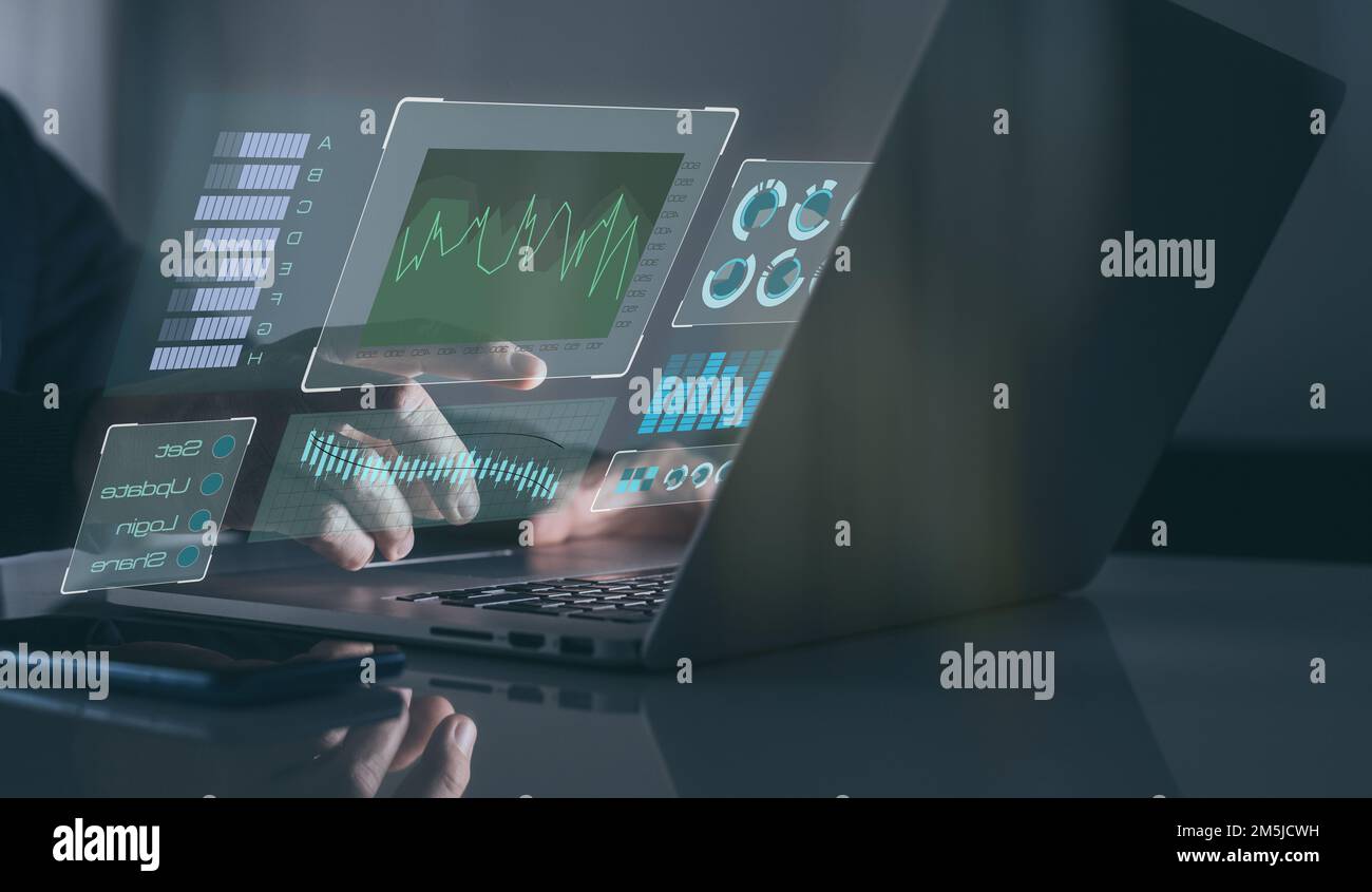 Graphs and charts on virtual computer screen. Businessman works ...