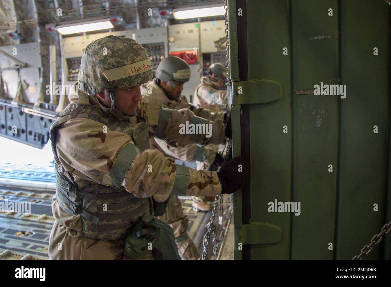 Tech. Sgt. Dustin Barboza, forward, a ramp services airman, Staff Sgt ...