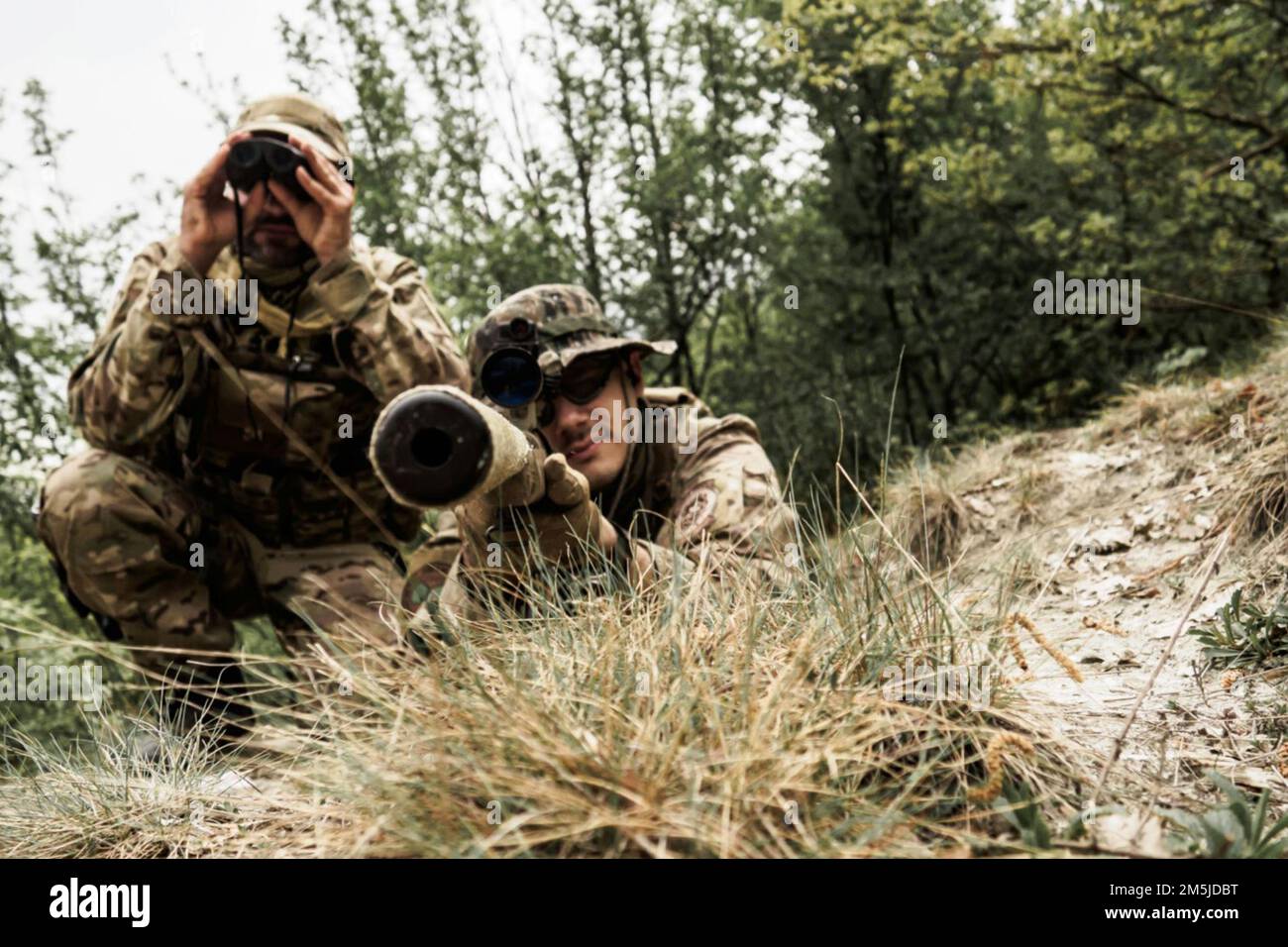 young soldiers in action on the battlefield Stock Photo - Alamy