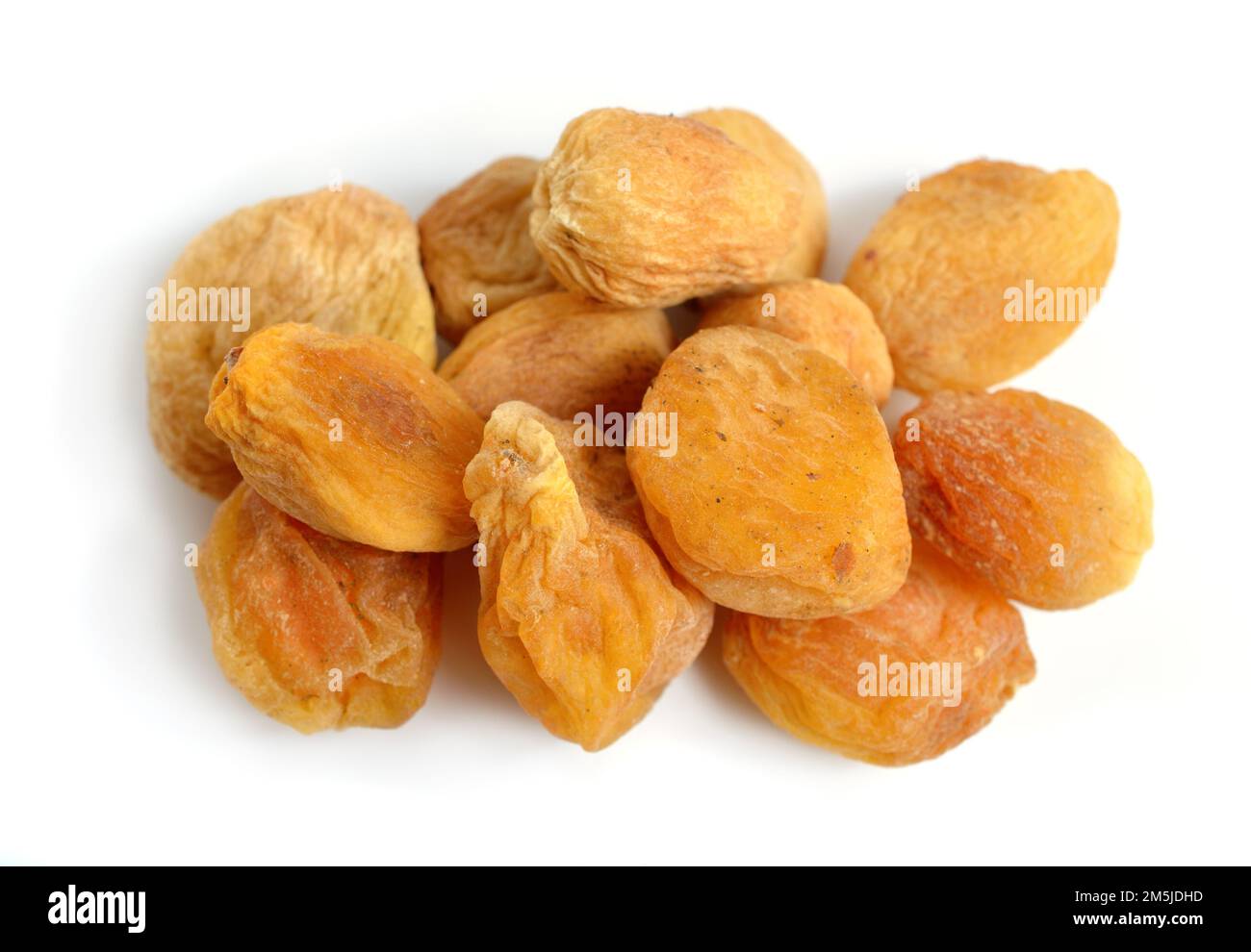 Whole Sun-dried apricots with stones. Isolated on white background ...