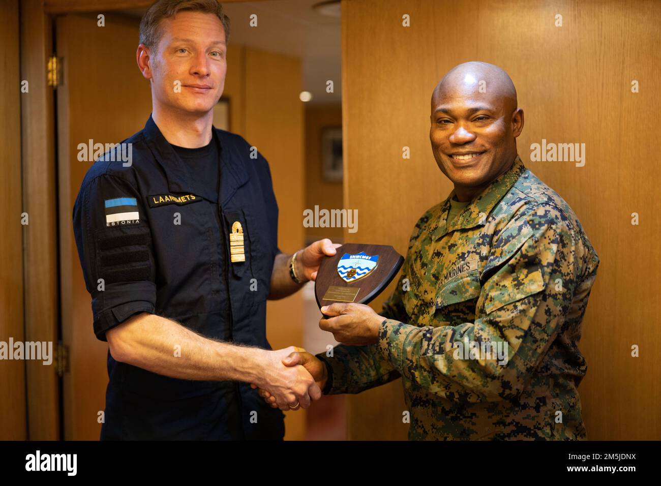 U.S. Marine Corps Brig. Gen. Anthony Henderson receives a gift from ...