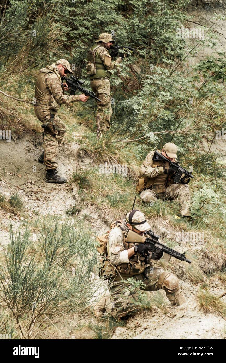young soldiers in action on the battlefield Stock Photo - Alamy