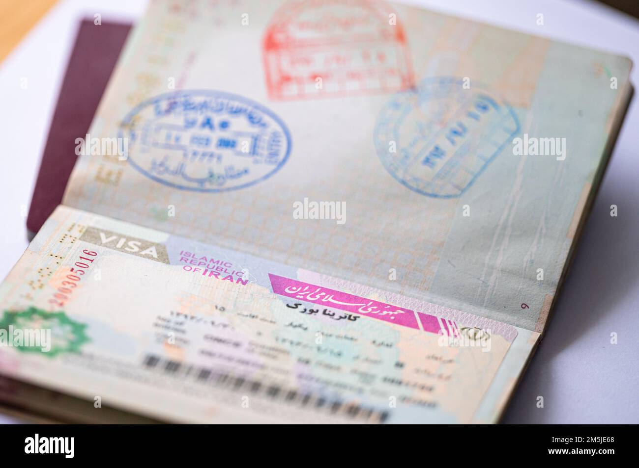 Close-up of a passport with an Iranian visa Stock Photo - Alamy