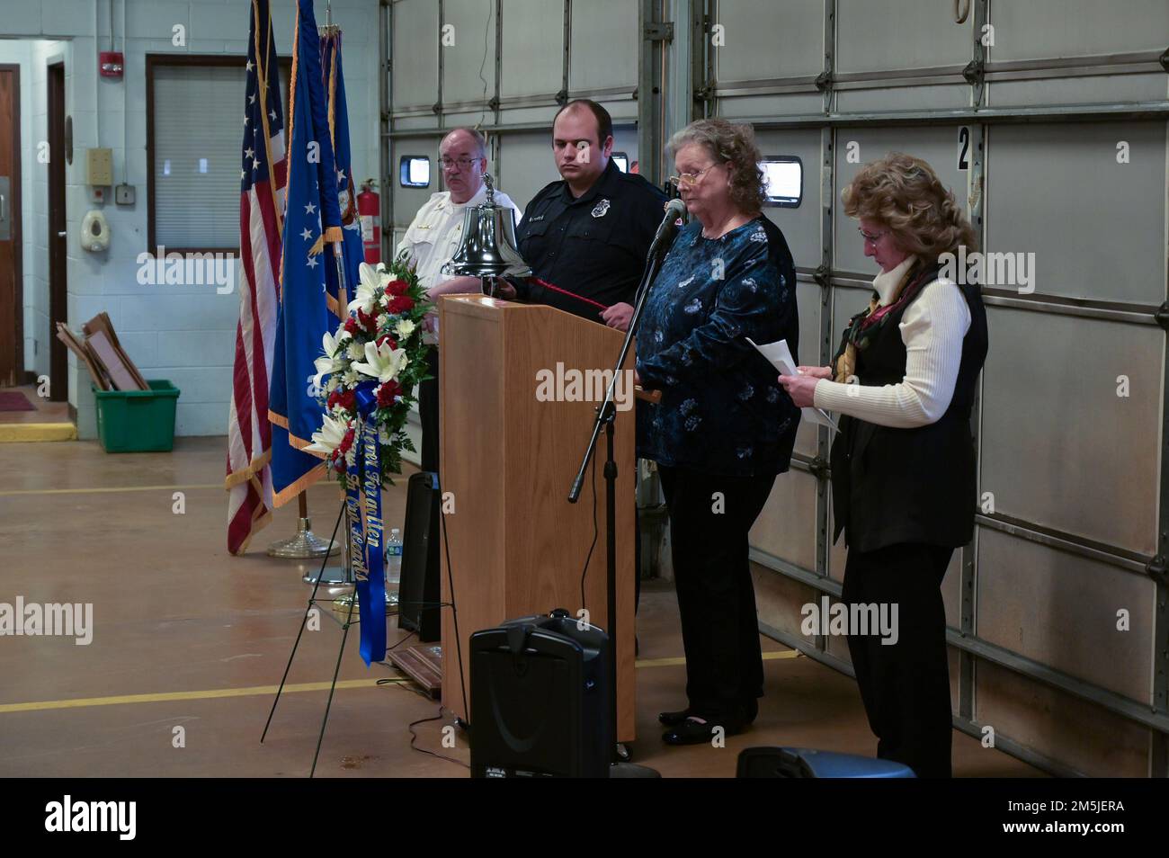 Marcy Jarecki (2nd right) and Mary Olczyk (right) read the names of the ...