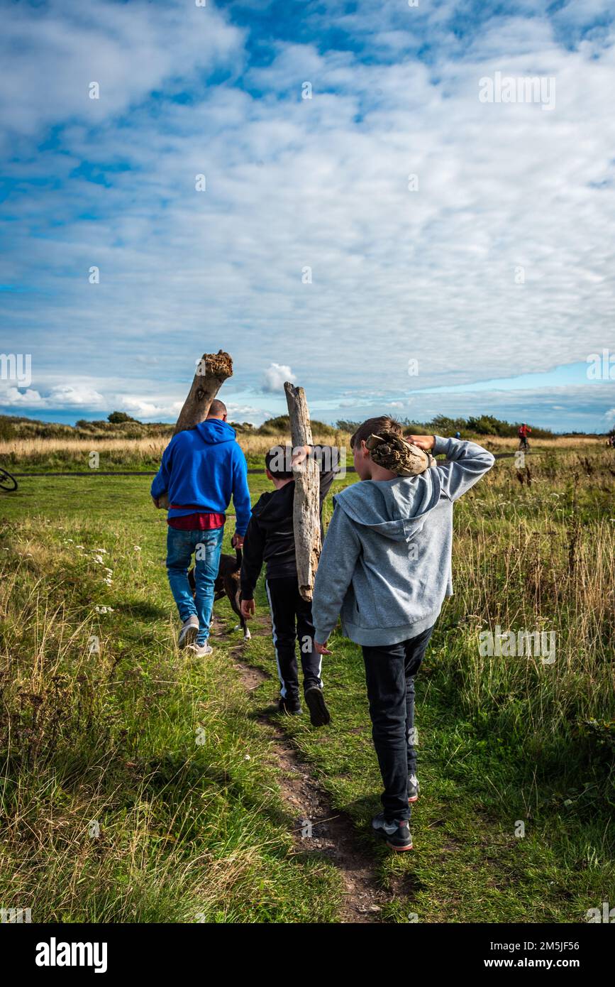 collecting and carrying firewood Stock Photo - Alamy