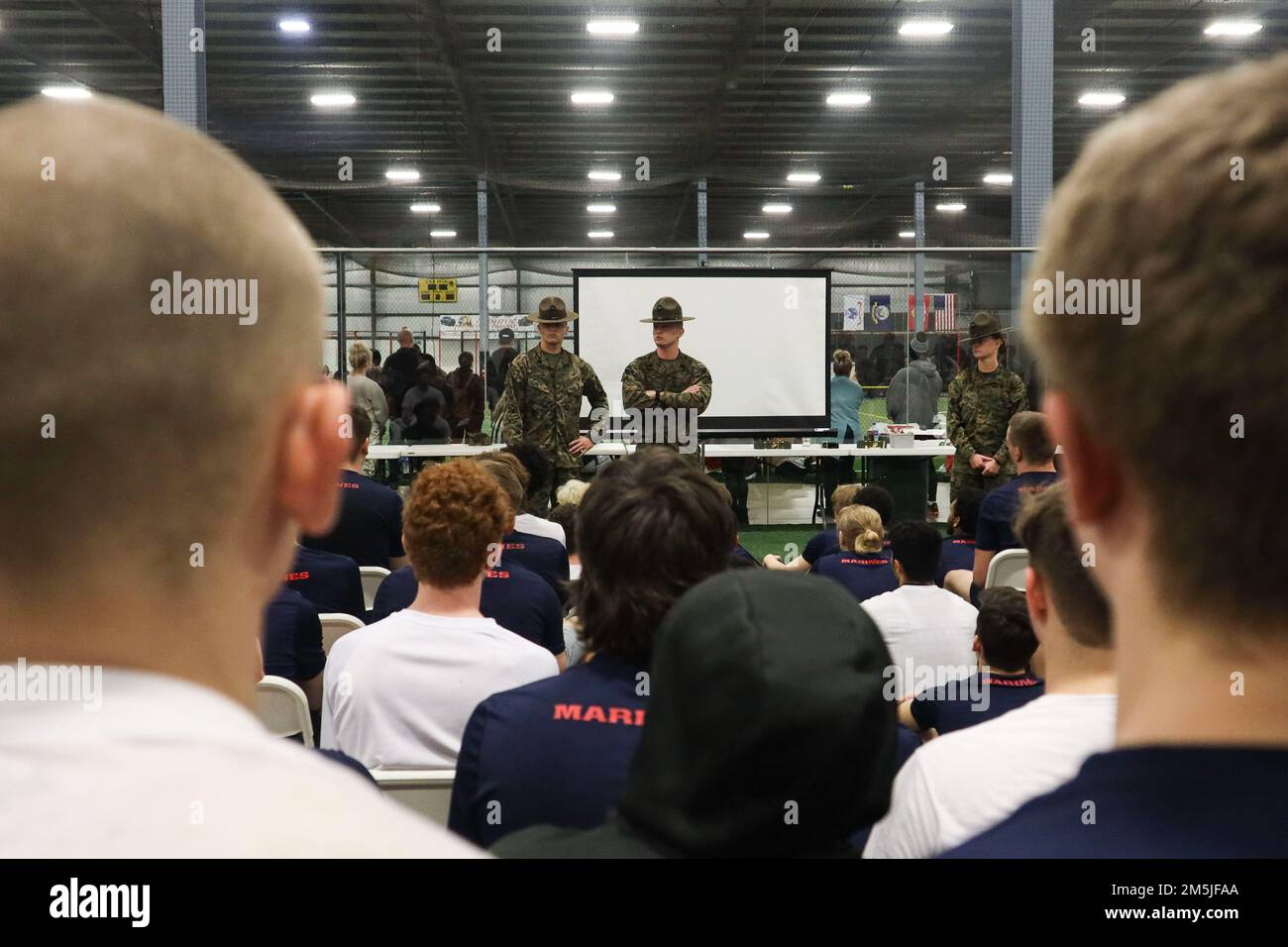 U.S. Marine drill instructors with Marine Corps Recruit Depot Parris Island, S.C., answer ...