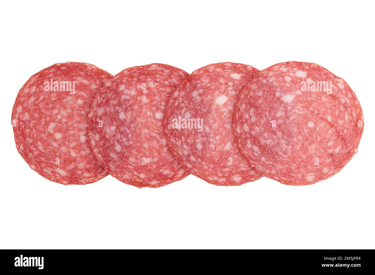 four pieces of sliced salami sausage laid out to create layout, salami sausage slices isolated ...