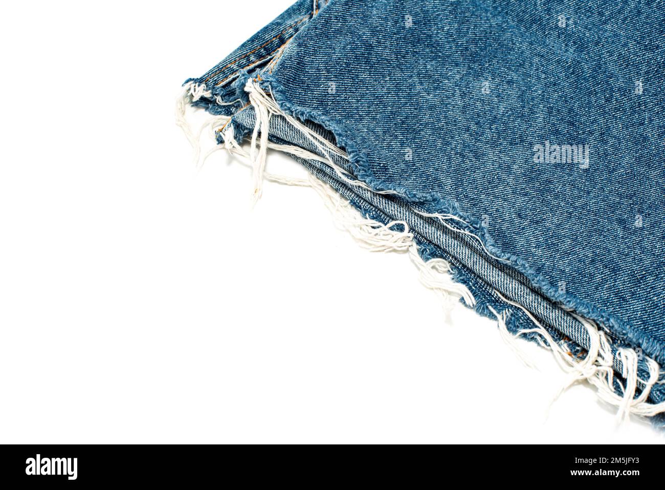 Frayed ripped jeans on a white background. Denim frame with empty space ...