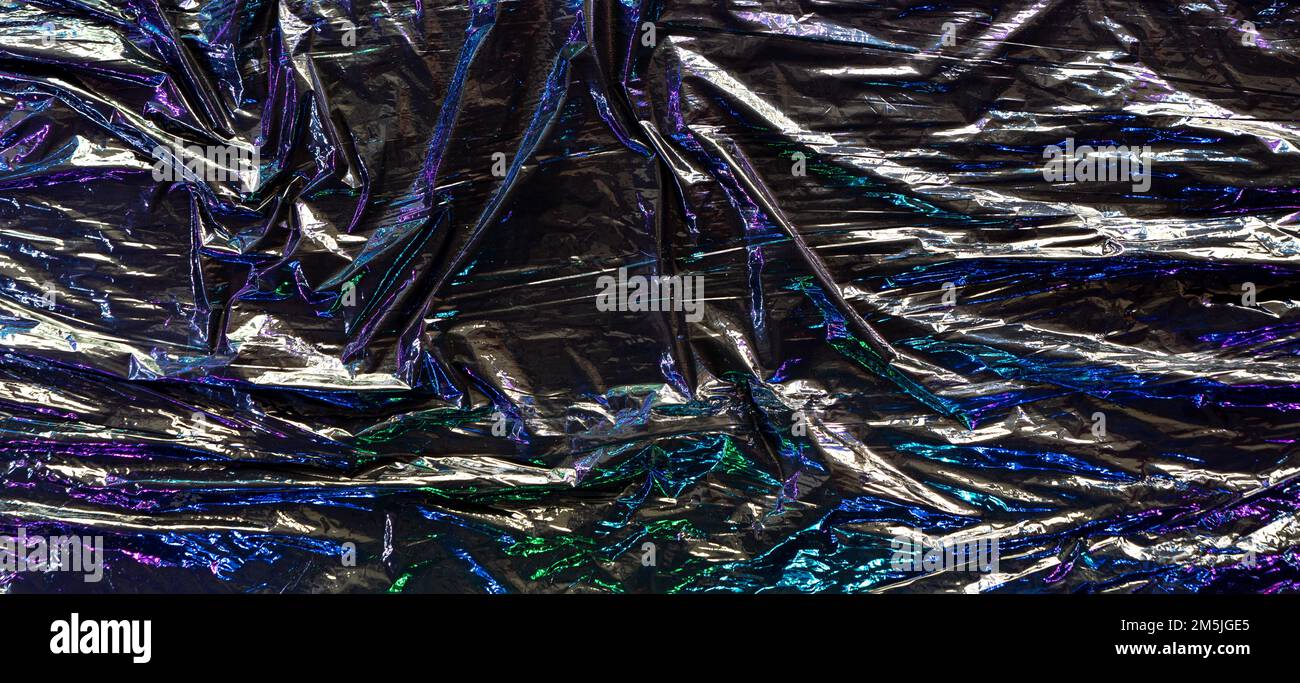 Black color plastic wrap background. Dark crumpled wrinkled plastic ...