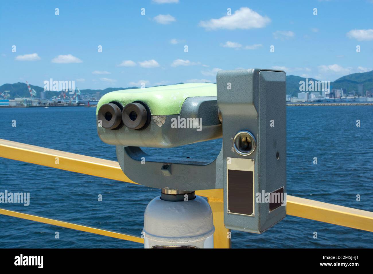 Sightseeing binoculars - telescope on sea tour ship Stock Photo - Alamy