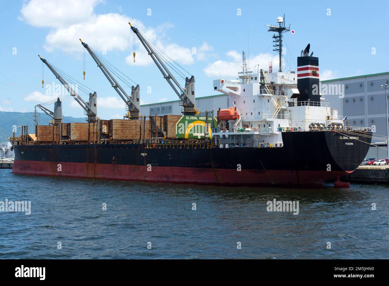 Container freight ship at dock in port Stock Photo - Alamy