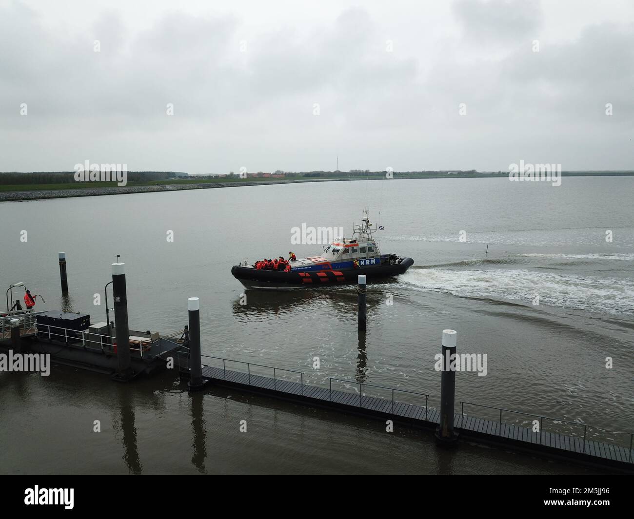 The lifeguard boat driving into the haven on the island of Ameland in ...
