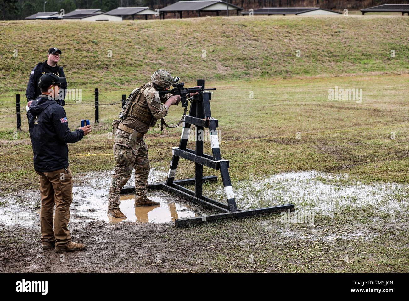 A competitor shoots a multi-gun match during the 2022 U.S. Army Small ...