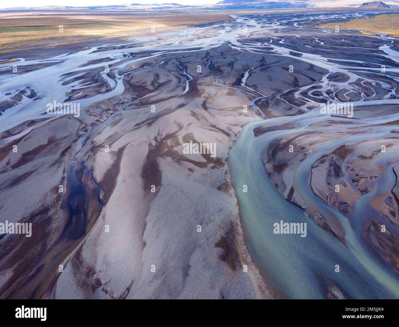 An aerial drone view of a huge riverbed and delta, glacial river system ...