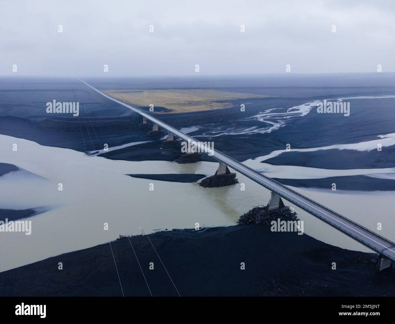 An aerial drone view of a huge riverbed and delta, glacial river system ...