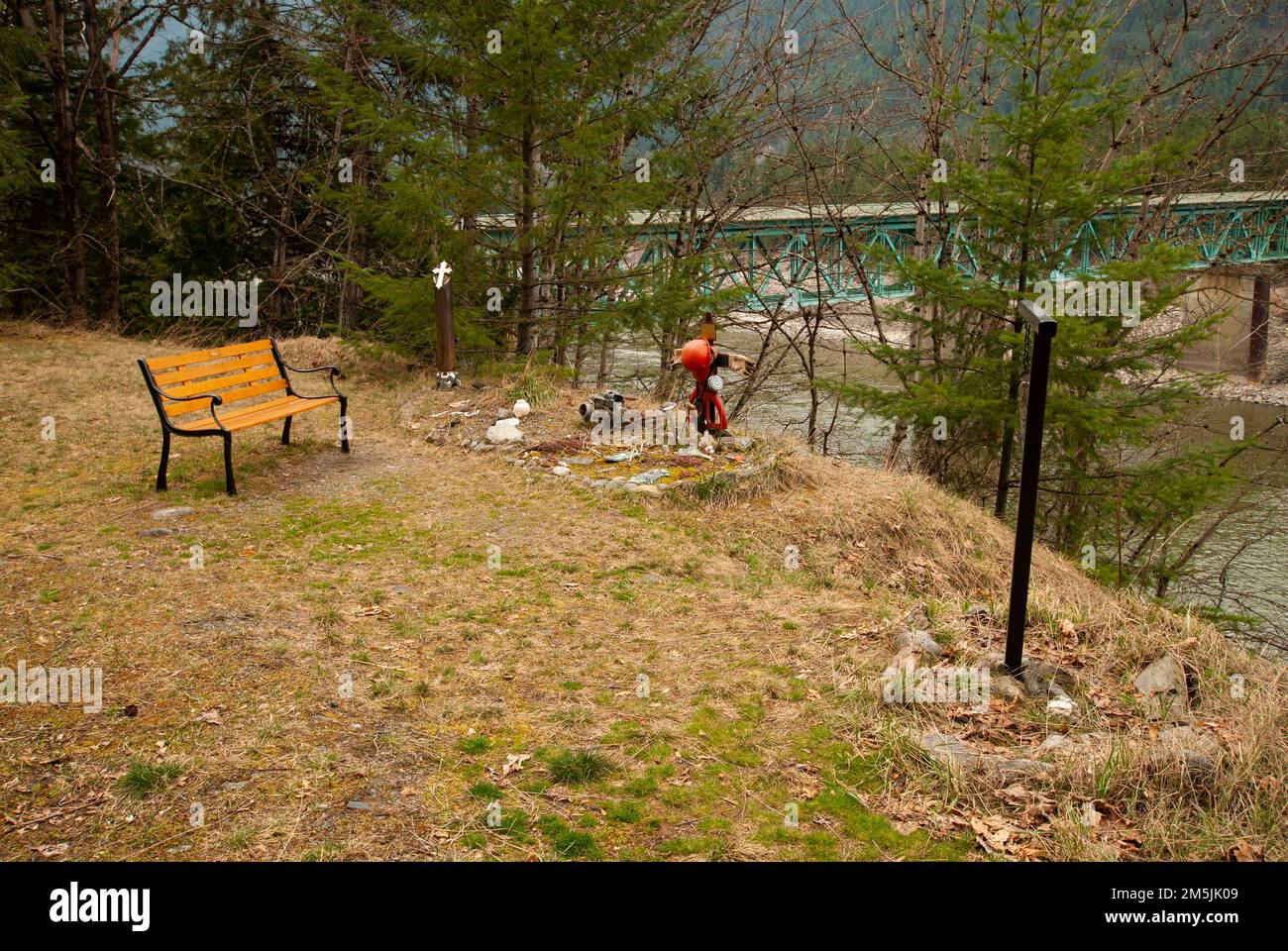 Bench and memorials overlooking the Fraser River in Boston Bar, British ...