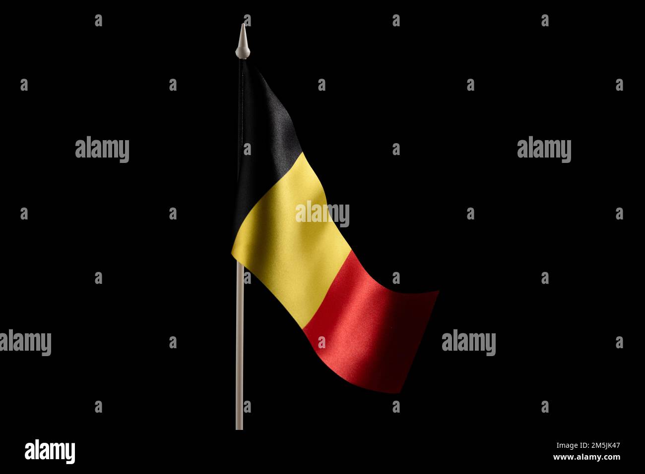 Small national flag of the Belgium on a black background Stock Photo ...