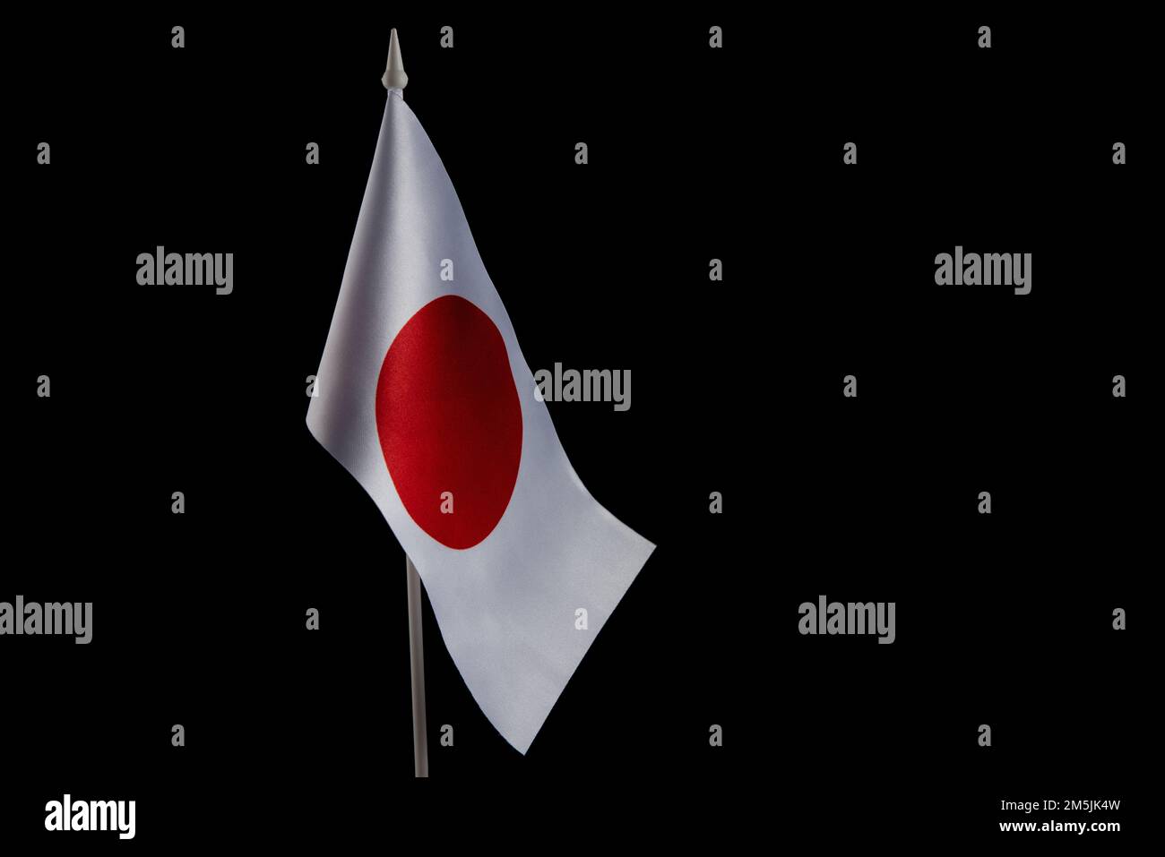 The Japanese flag on a black background. Isolate Stock Photo - Alamy