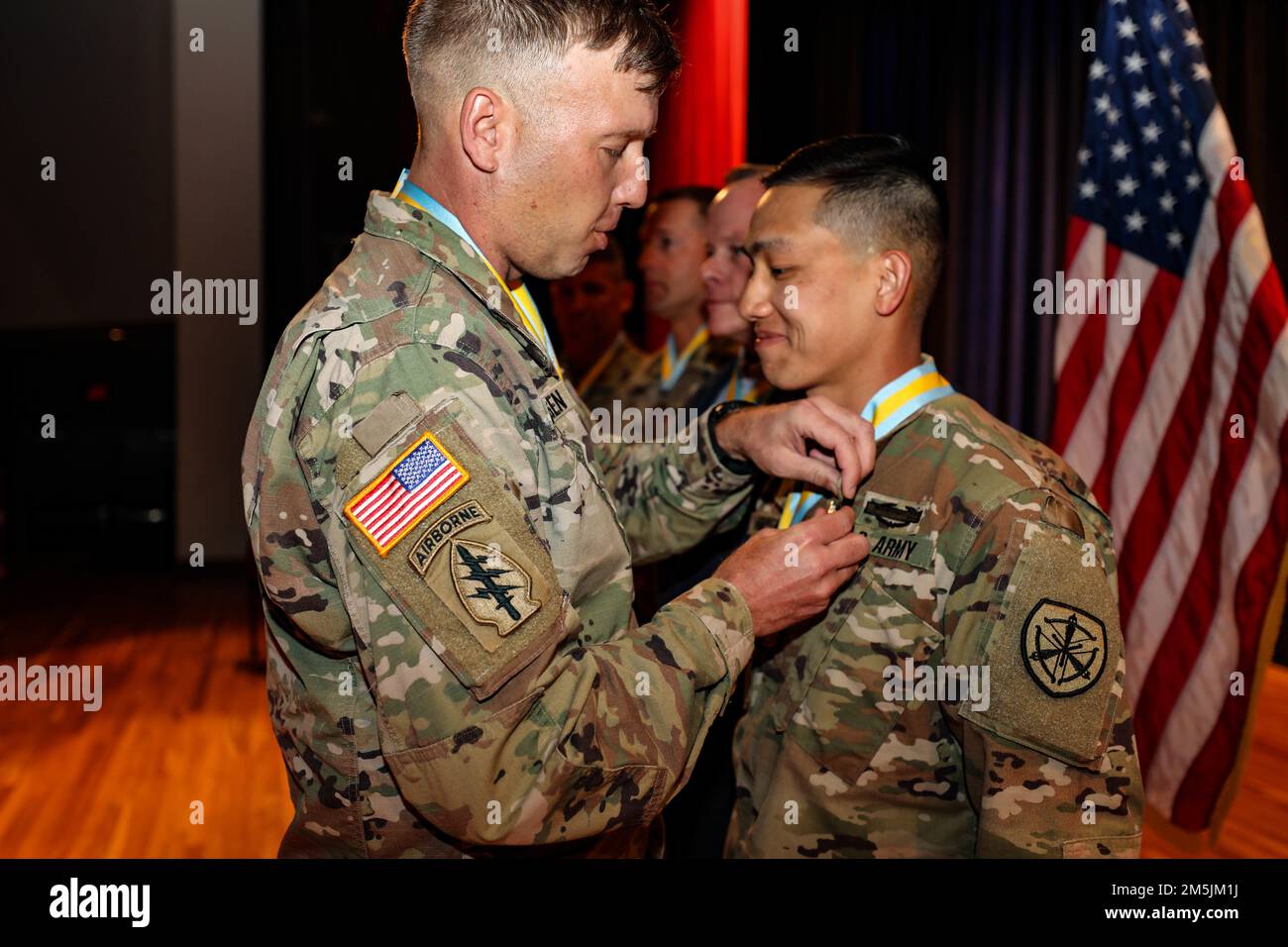 U.S. Army Marksmanship Unit Commander Lt. Col. Erik Andreasen pins a ...