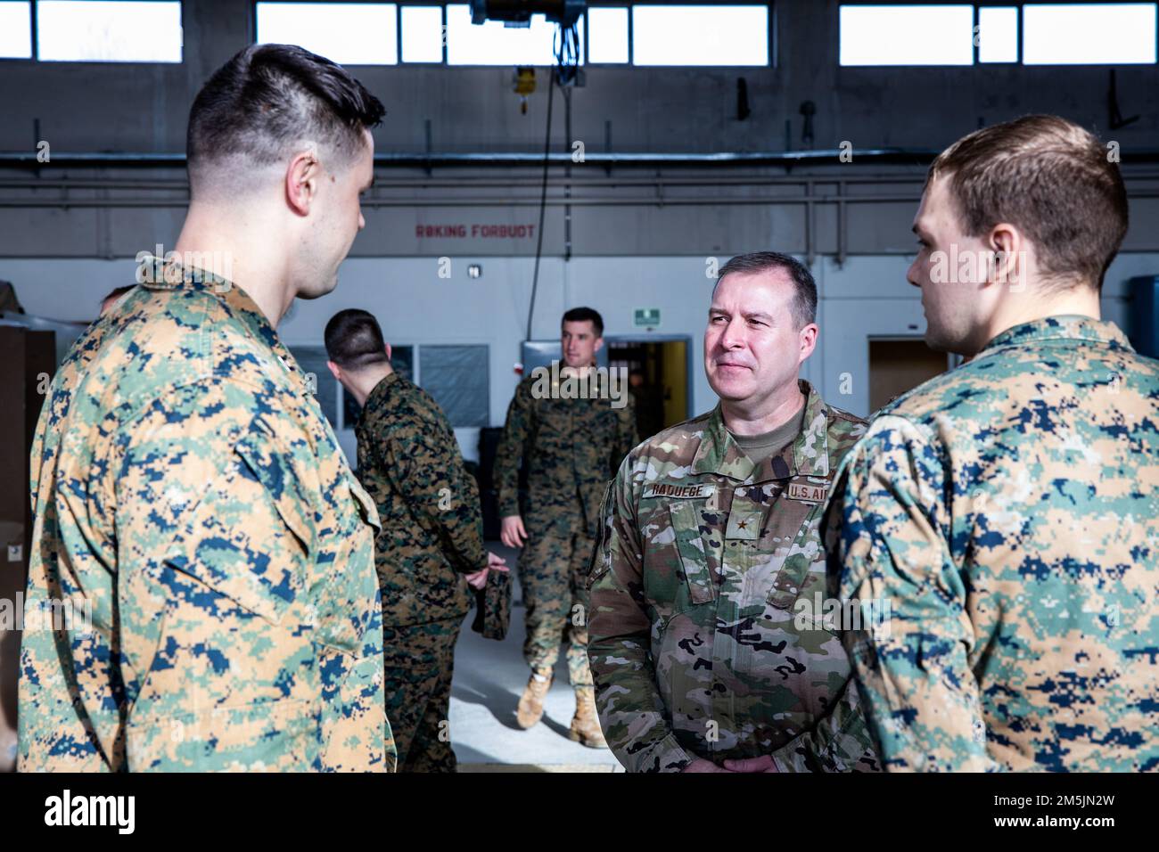 U.S. Air Force Brig. Gen. Chad Raduege speaks with U.S. Marine Corps ...