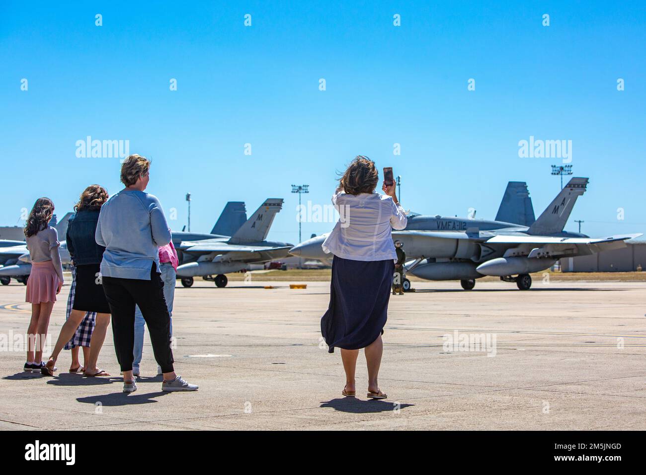 Family and friends of Marines with Marine Fighter Attack Squadron 112 (VMFA-112) prepare to ...