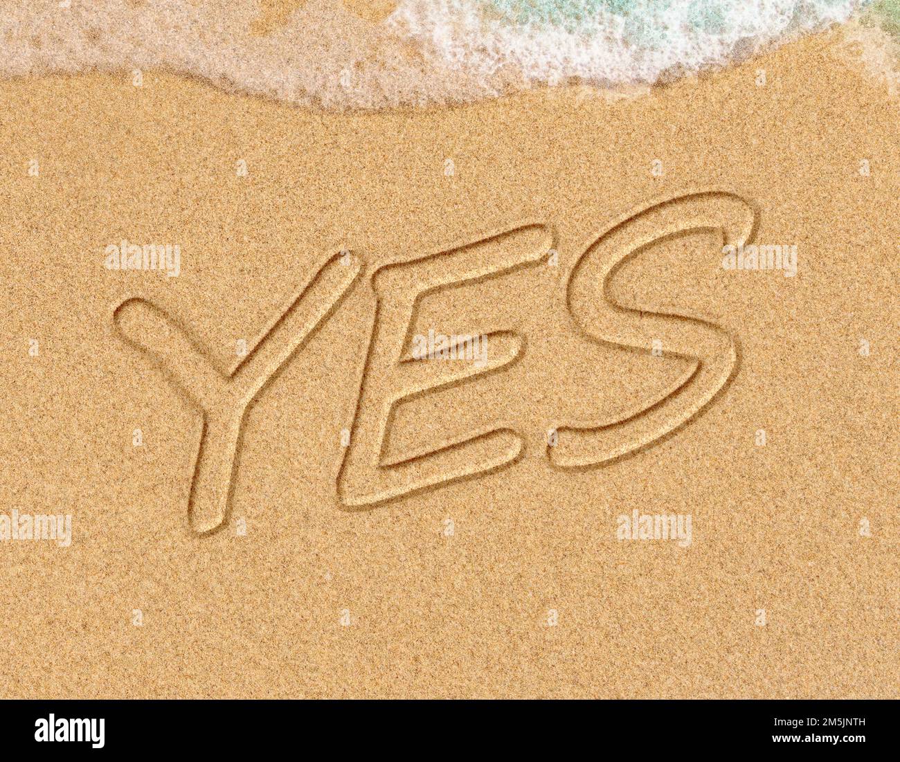 YES concept, positive changes in the life, word written on sand beach ...