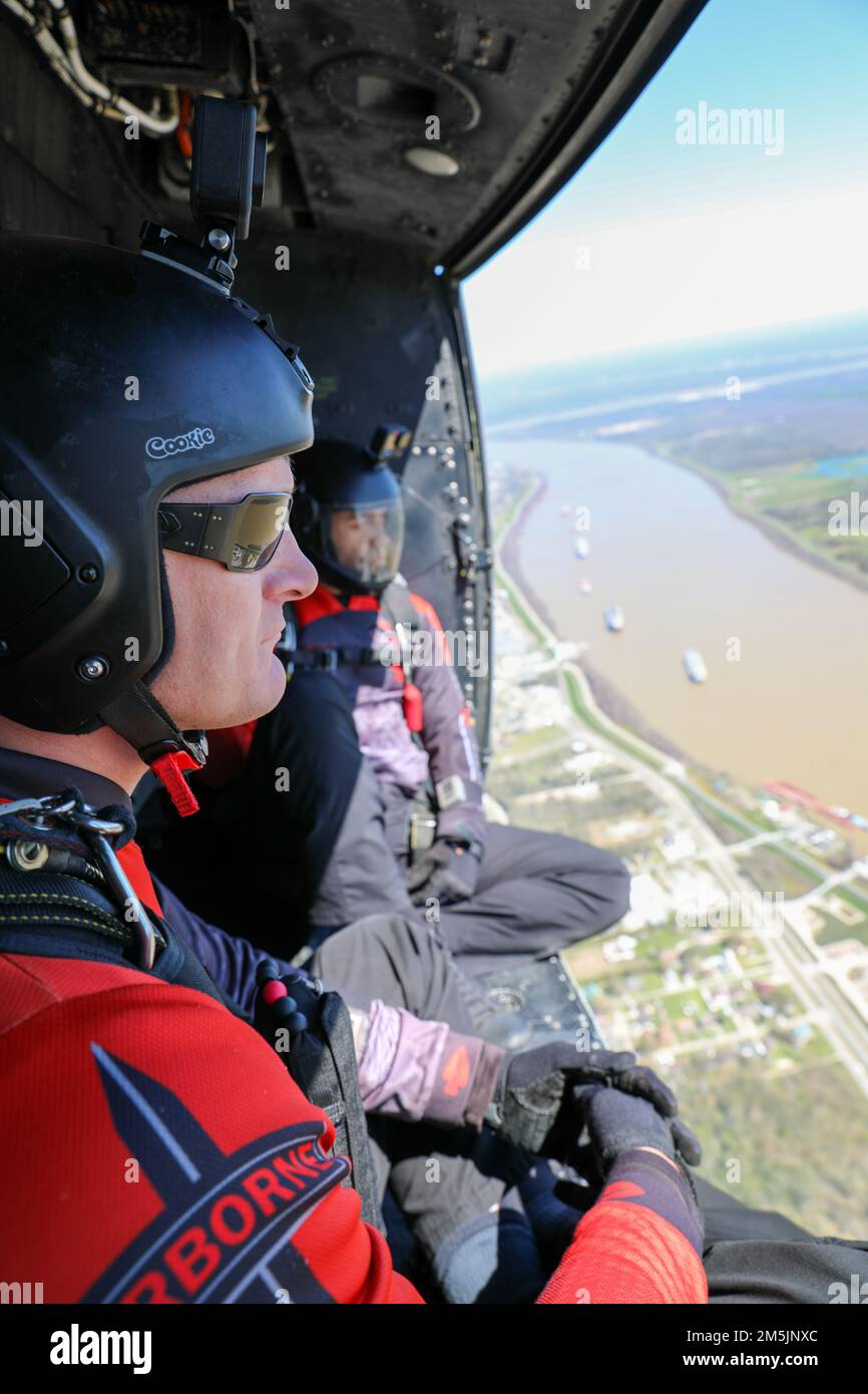 Sgt. 1st Class Roger Ross (front), a parachutist with the United States ...