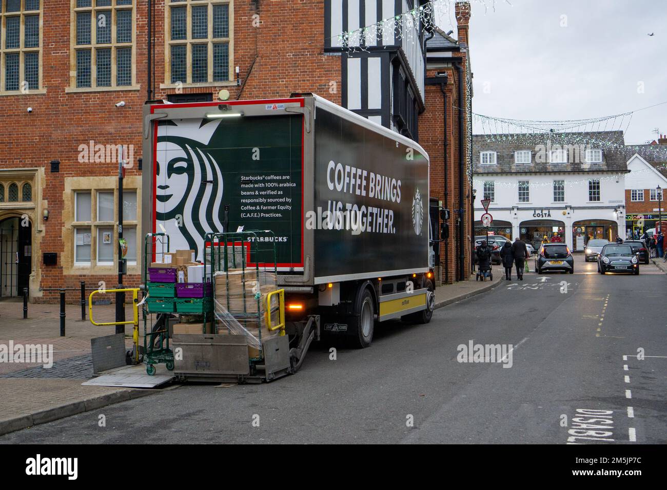 Starbucks coffee delivery truck unloading supplies in a shopping area ...