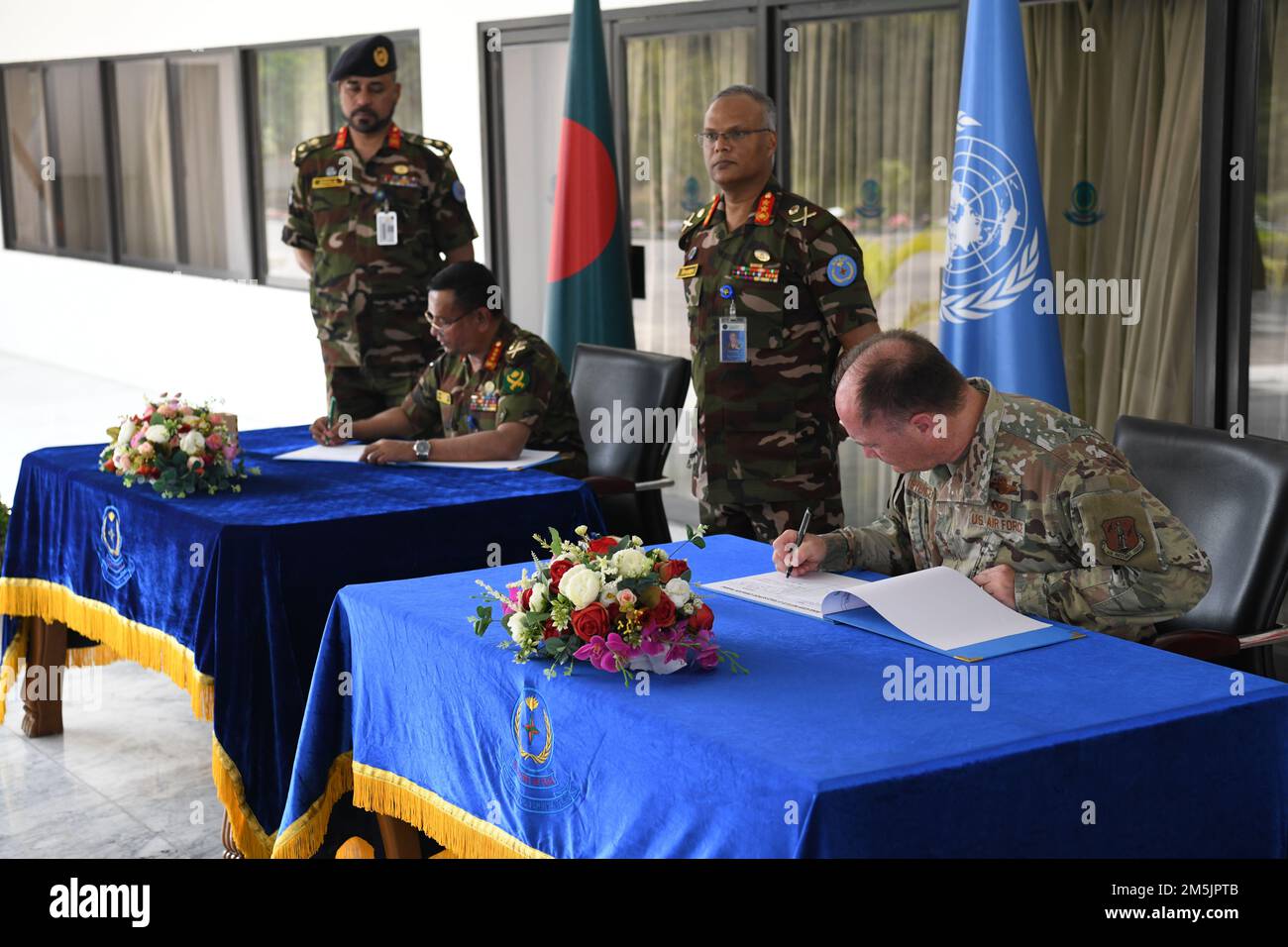 Maj. Gen. Michael Stencel, Adjutant General, Oregon (right), signs the ...