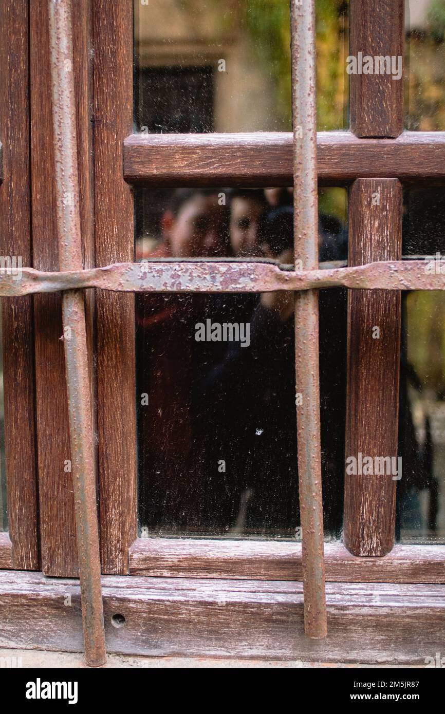 A window and the reflection of people, vertical Stock Photo - Alamy