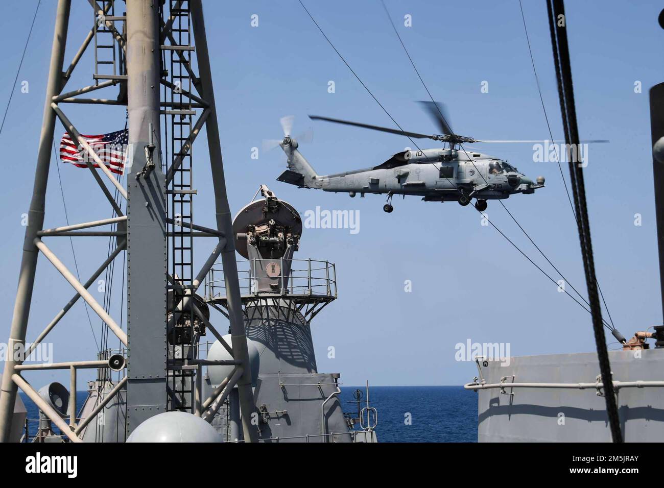 SOUTH CHINA SEA (March 20, 2022) An MH-60R Sea Hawk helicopter assigned ...