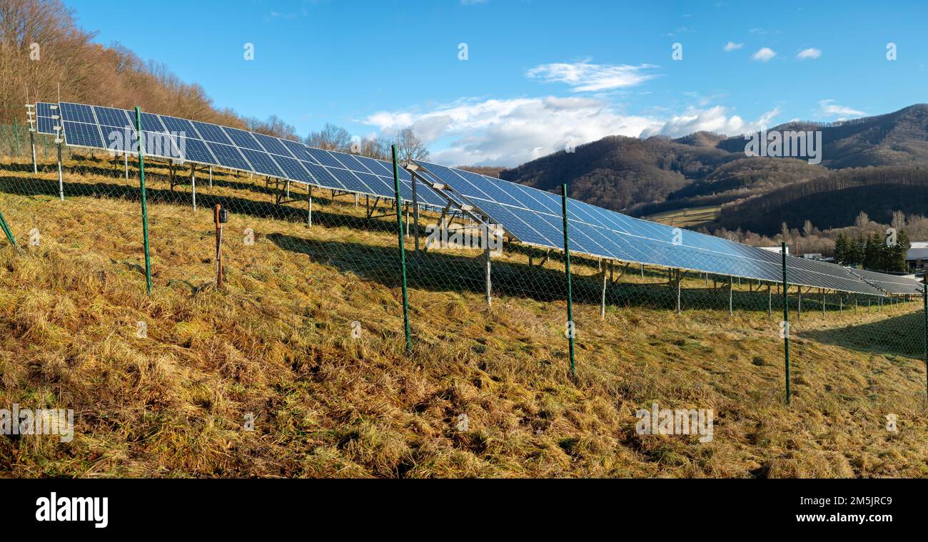 A solar photovoltaic power plant on the field. Solar panels on the ...