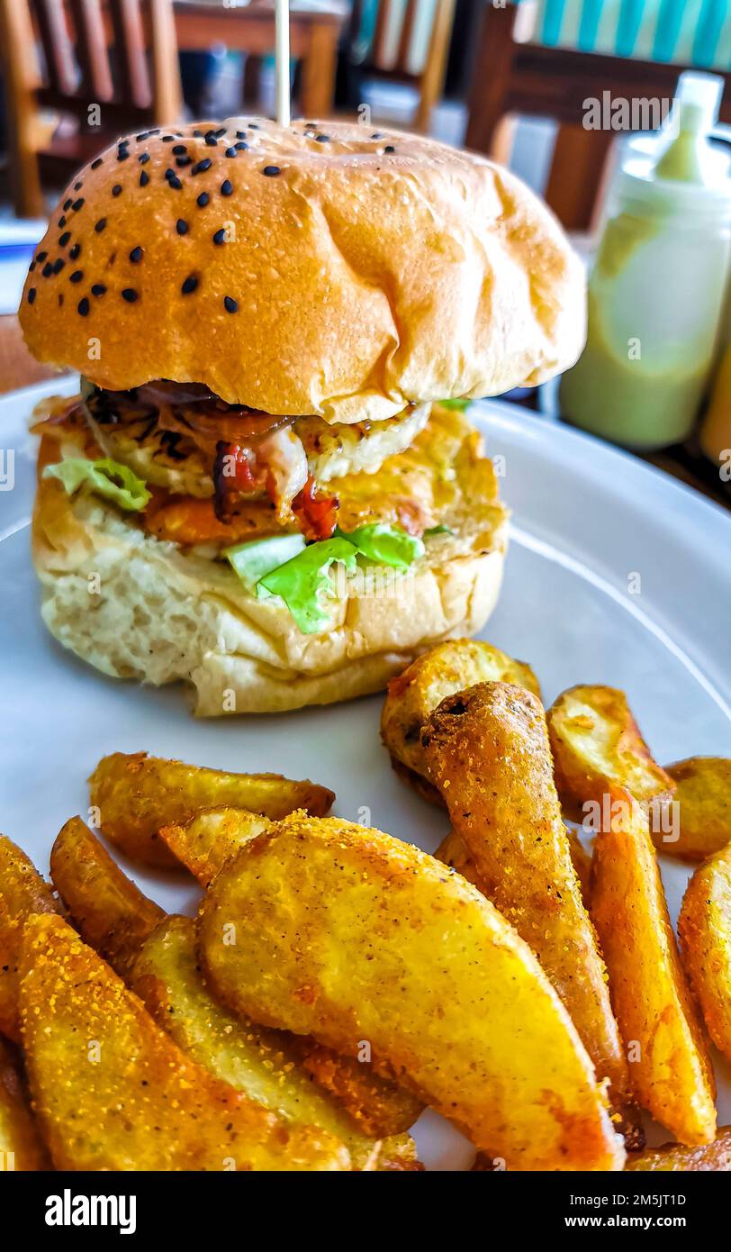 Fast food in the restaurant hamburger and fries in Playa del Carmen ...