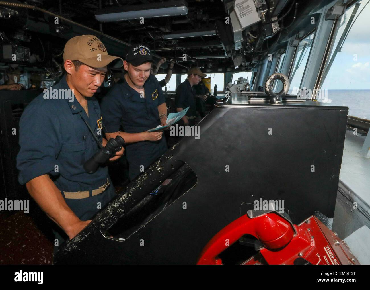 PHILIPPINE SEA (March 20, 2022) Lt. John Arion (right), from Dallas ...