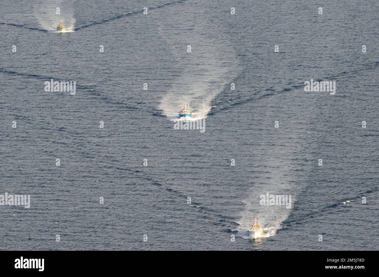 View of fishing boats returning to port. Rausu. Shiretoko Peninsula ...