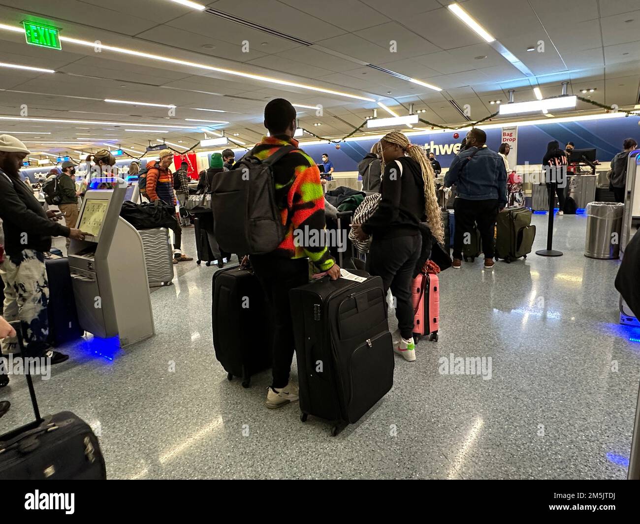 Passengers check in baggage at the Southwest Airlines ticket counter at ...