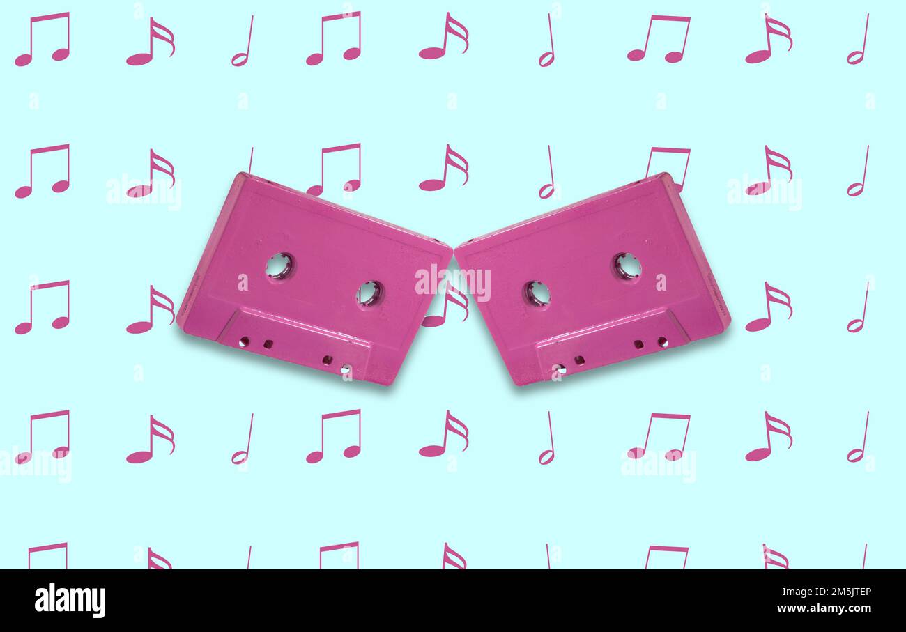 retro pink audio cassette on blue background, music notes around ...
