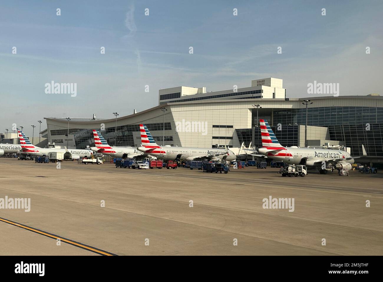 American Airlines planes parked at the terminal gates at the Dallas ...