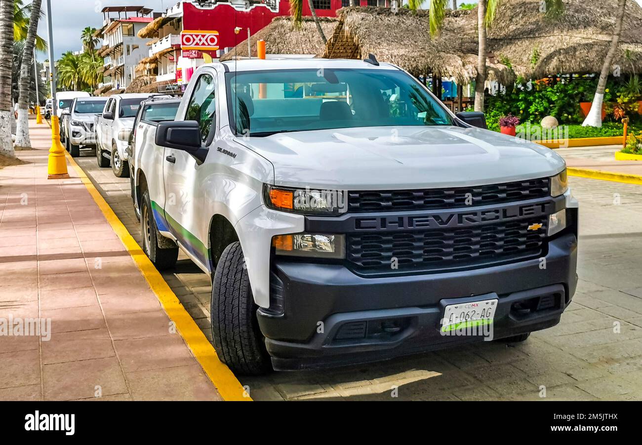 Various Mexican pickup trucks cars 4x4 Off-road vehicles in Puerto Escondido zicatela Oaxaca ...