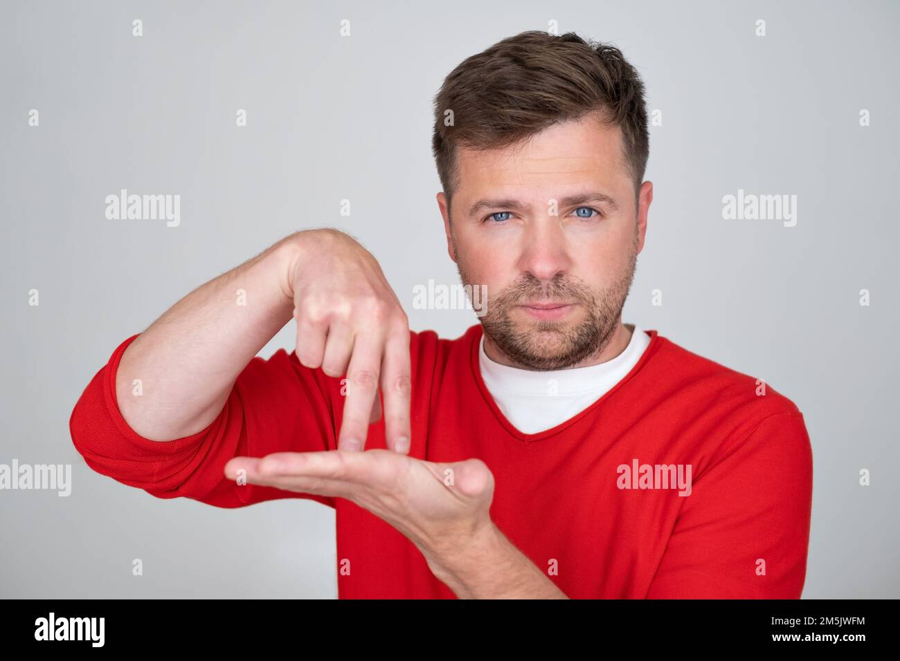 man showing two fingers on his palm, gesture meaning go by foot, afoot ...