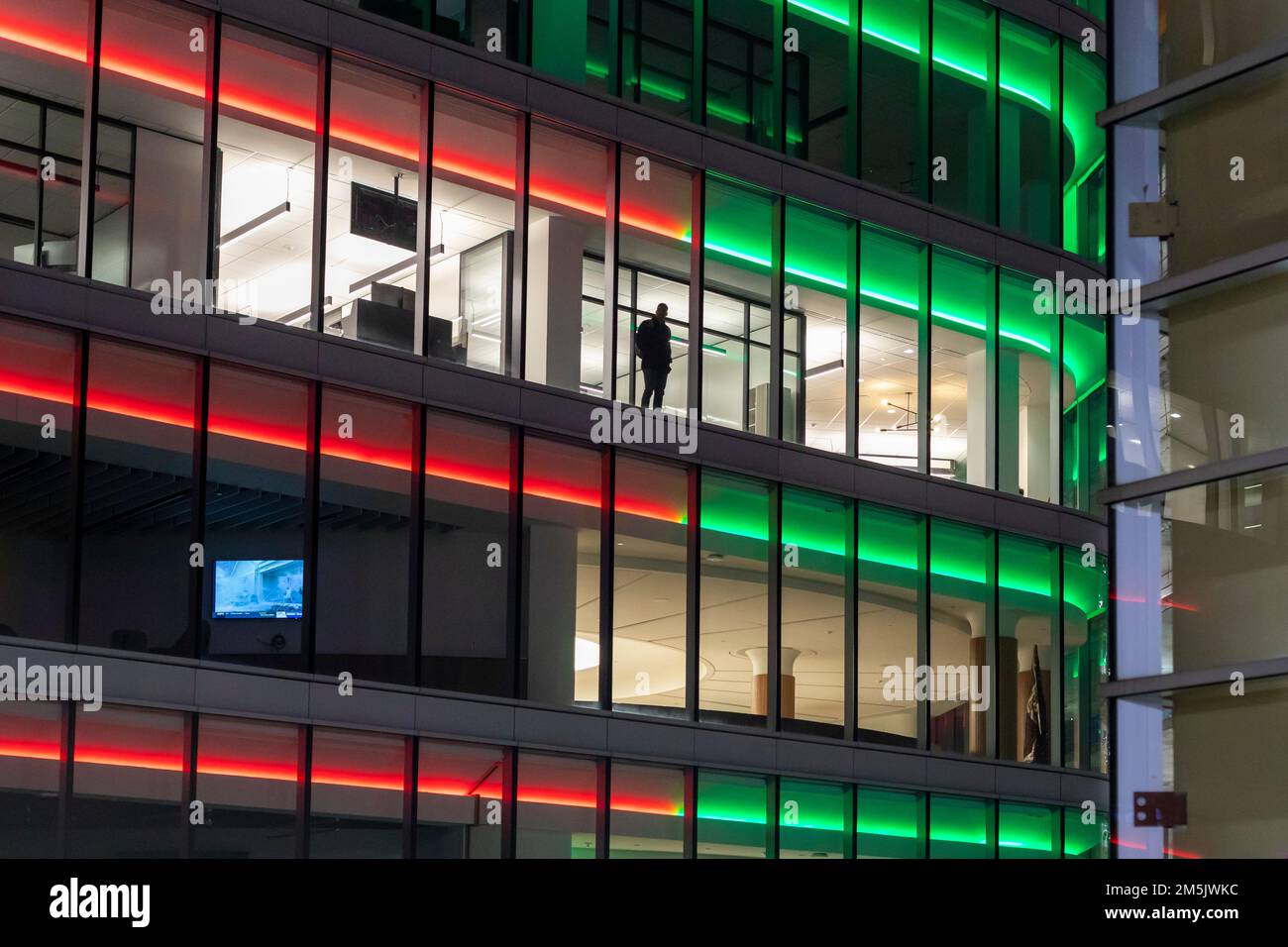 Detroit, Michigan - A man looks out of a window in the One Campus ...