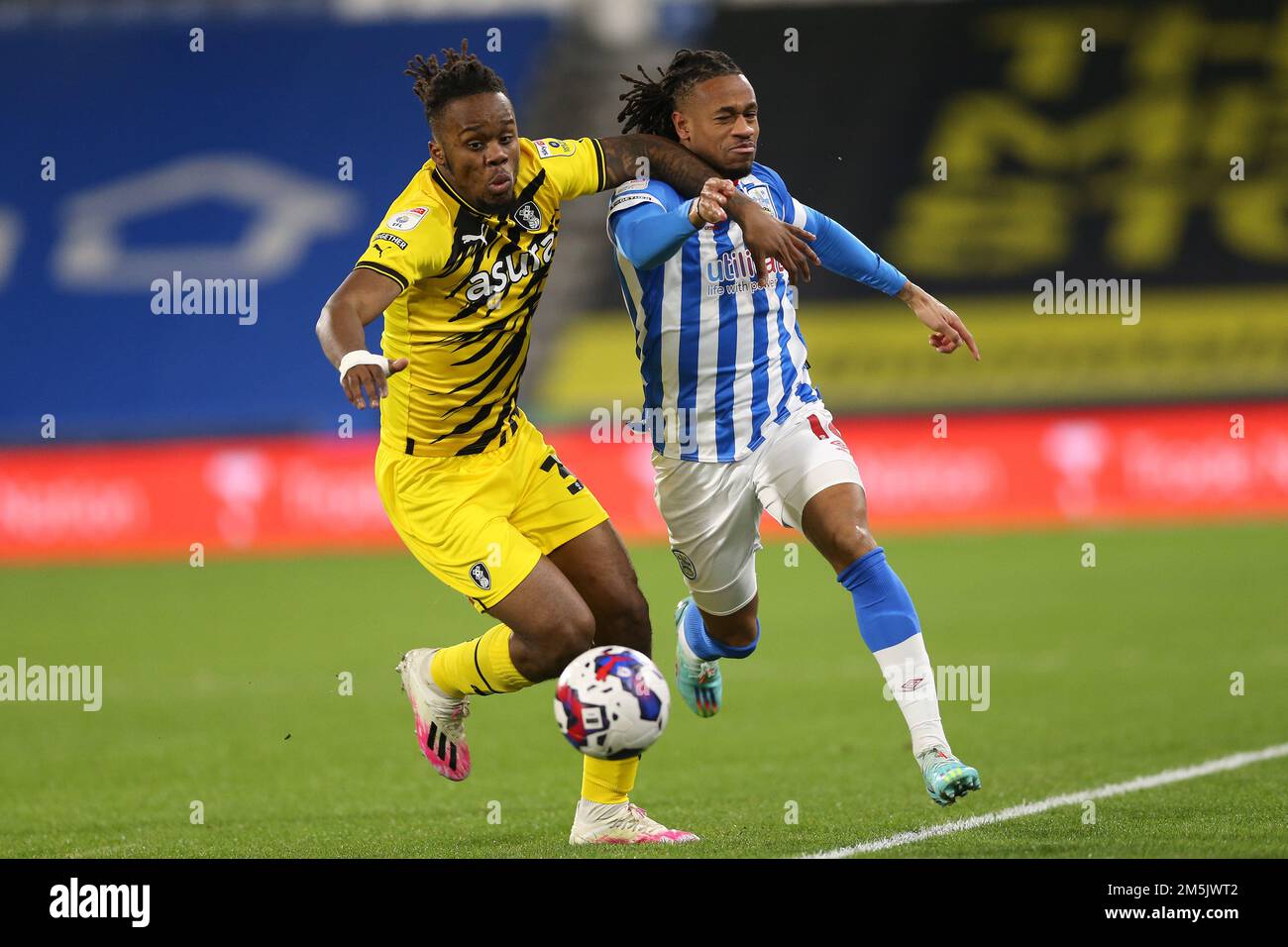 Huddersfield Town's David Kasumu and Rotherham United's Peter Kioso ...